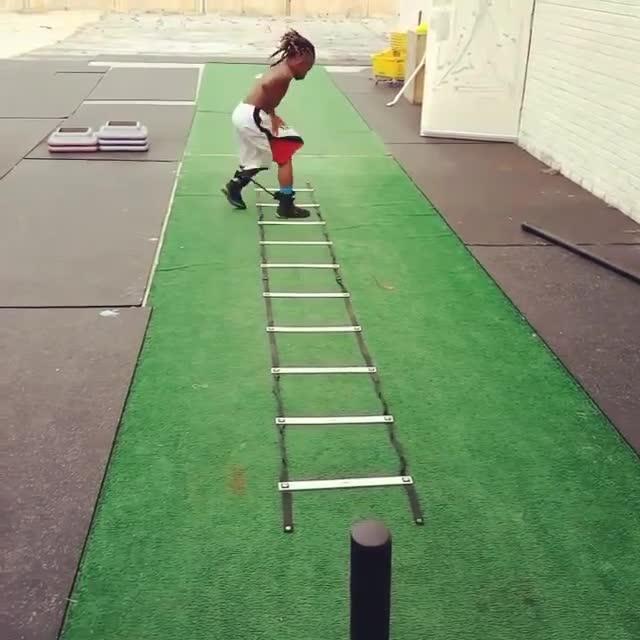 Boy Uses Resistance Bands on Training Ladder | Jukin Licensing