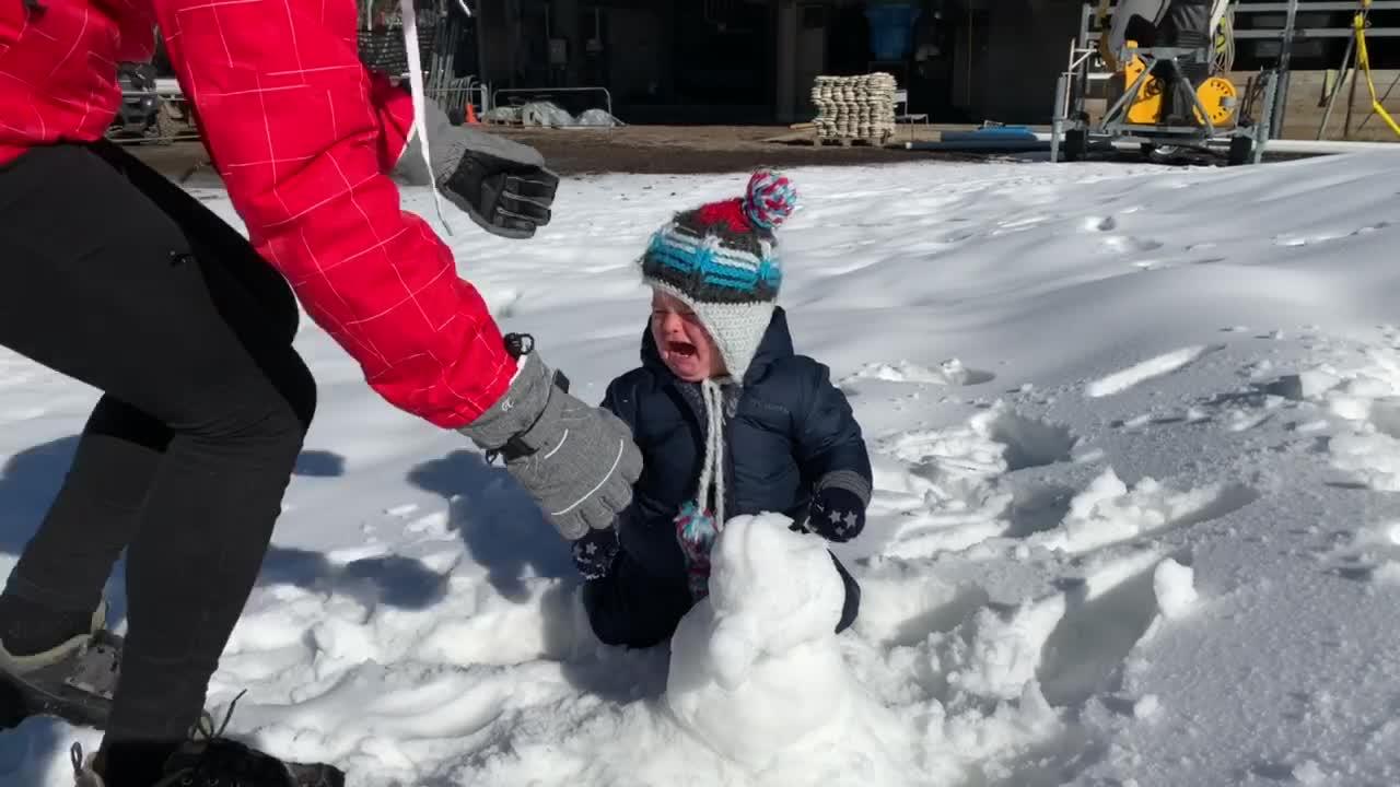 Toddler Stumbles Falling Face First into Snowman | Jukin Licensing