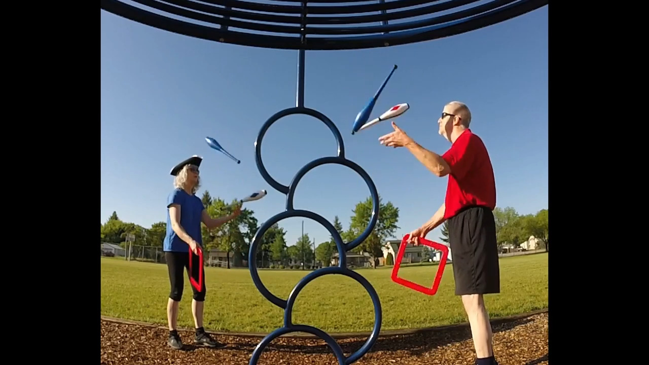 Couple Demonstrates Awesome Skills While Pass Juggling Square Frames ...