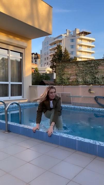 Woman Accidentally Falls Into Pool While Posing by it | Jukin Licensing