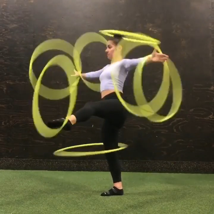 Woman Spins Multiple Hula Hoops on Different Body Parts Simultaneously ...