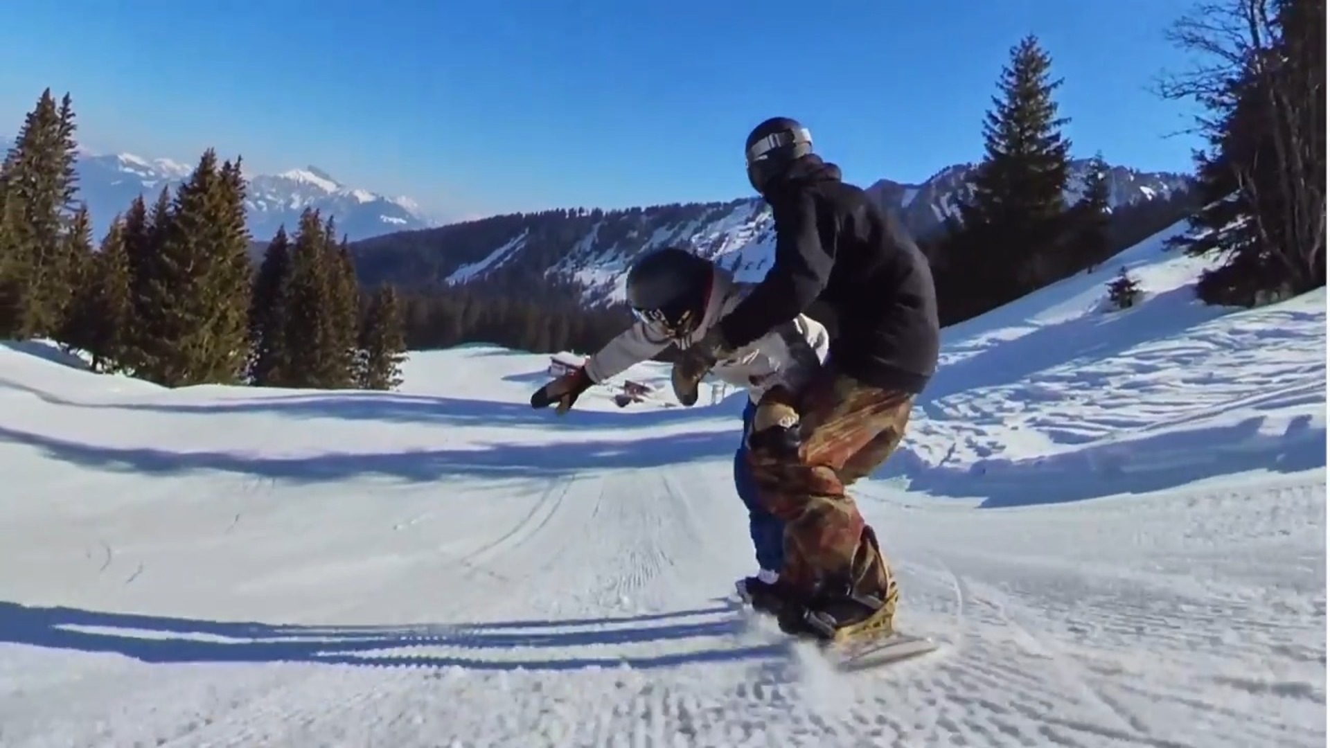 Duo Keeps Falling While Trying To Ride Tandem Snowboard | Jukin Licensing
