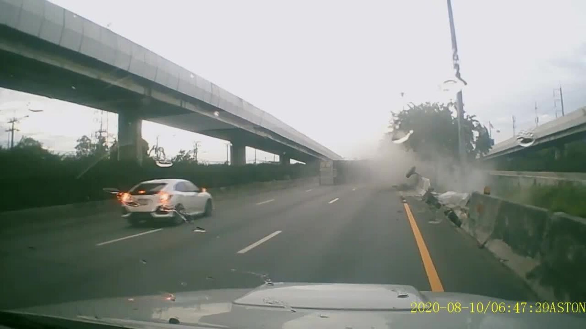 Truck Topples Over After Colliding With Barrier | Jukin Licensing