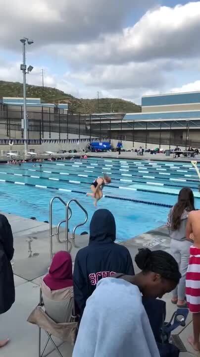 Woman Falters While Diving Off Diving Board | Jukin Licensing