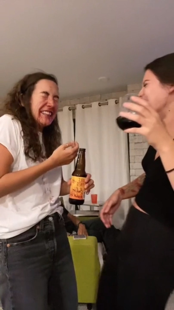 Women Laugh Hysterically After Spitting Mouthfuls of Drinks on Each ...