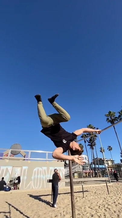 Guy Swinging From Horizontal Pole Performs Brilliant Flips | Jukin ...