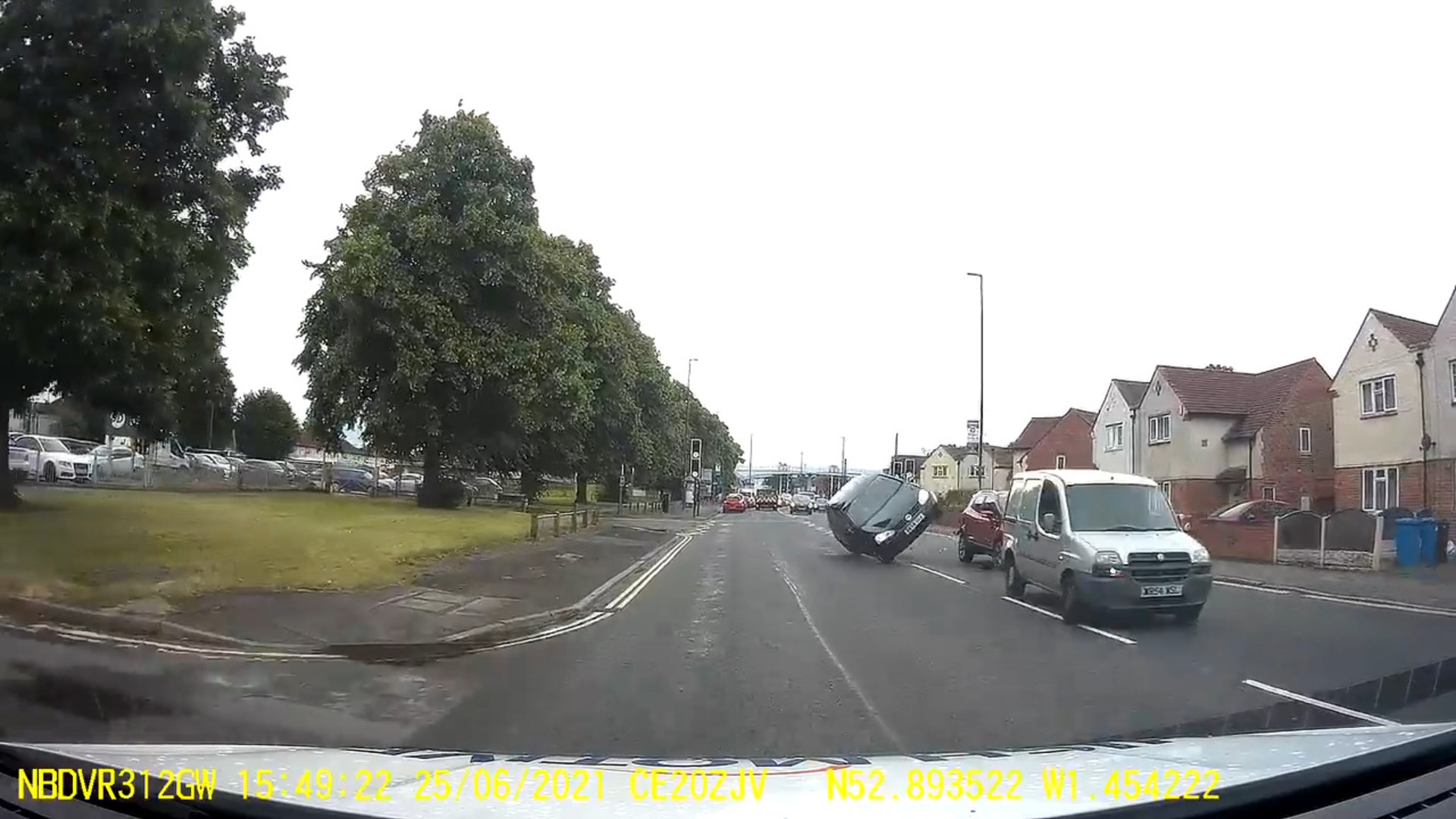 Oncoming Car Tipped to Two Wheels in Traffic | Jukin Licensing