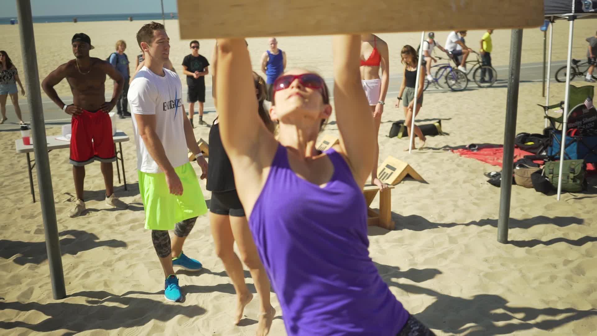 Woman Works Through Beach Obstacle Course | Jukin Licensing