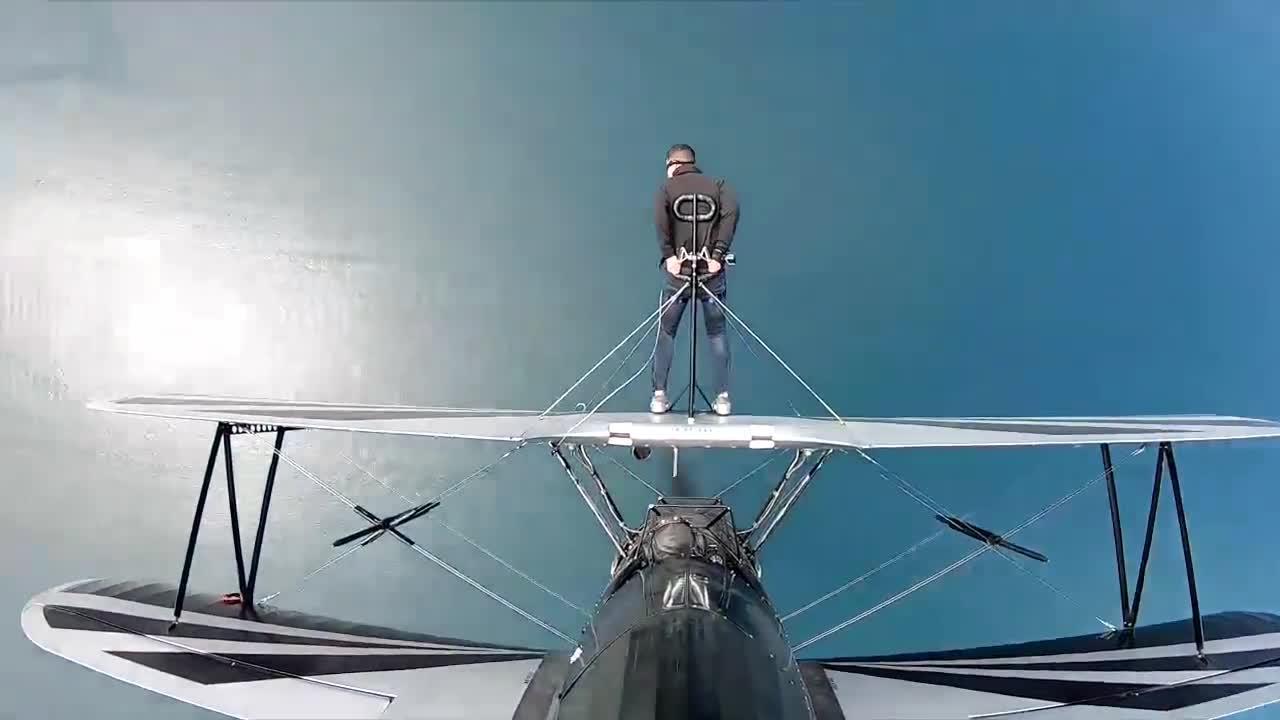 Man Walks on Wings of Biplane as It Flies in Air | Jukin Licensing