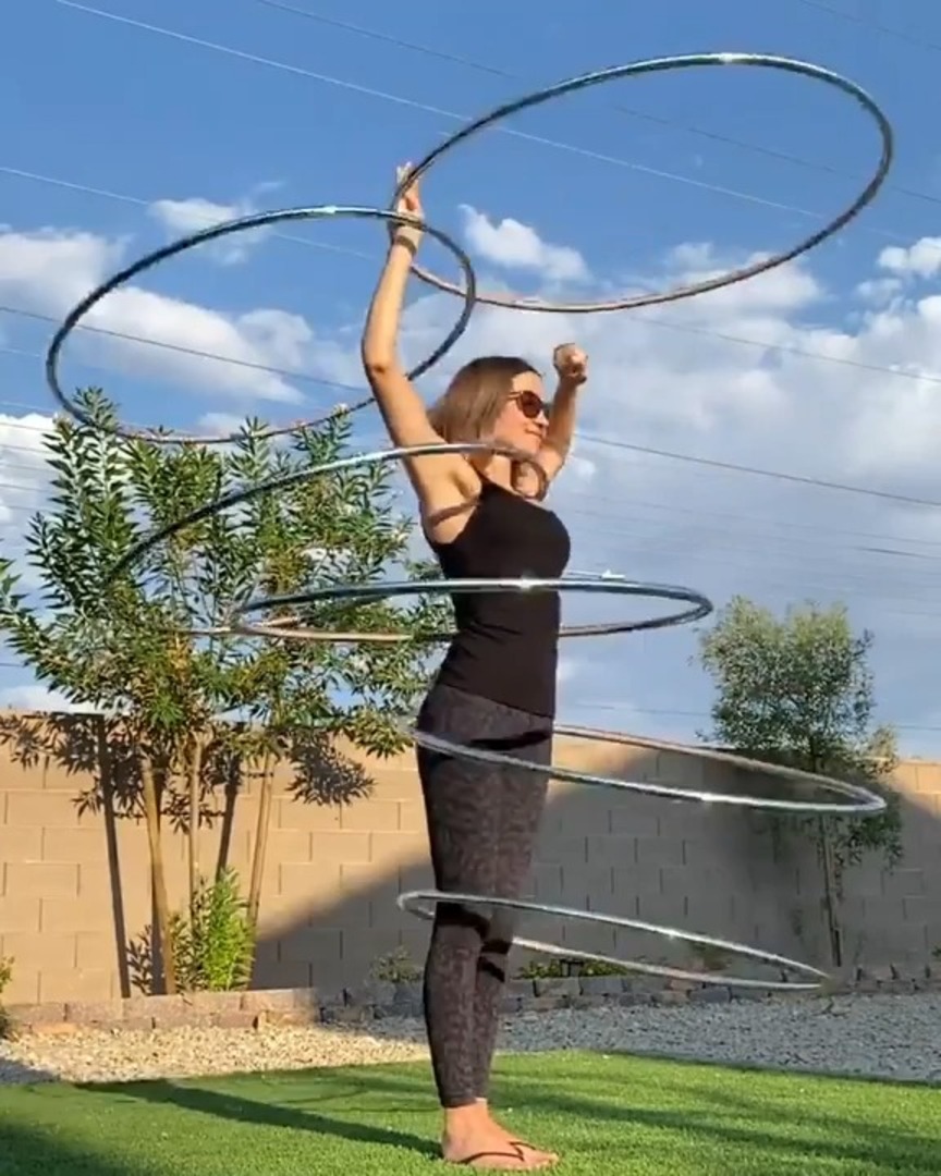 Woman Spins Multiple Hula Hoops Around her Body | Jukin Licensing