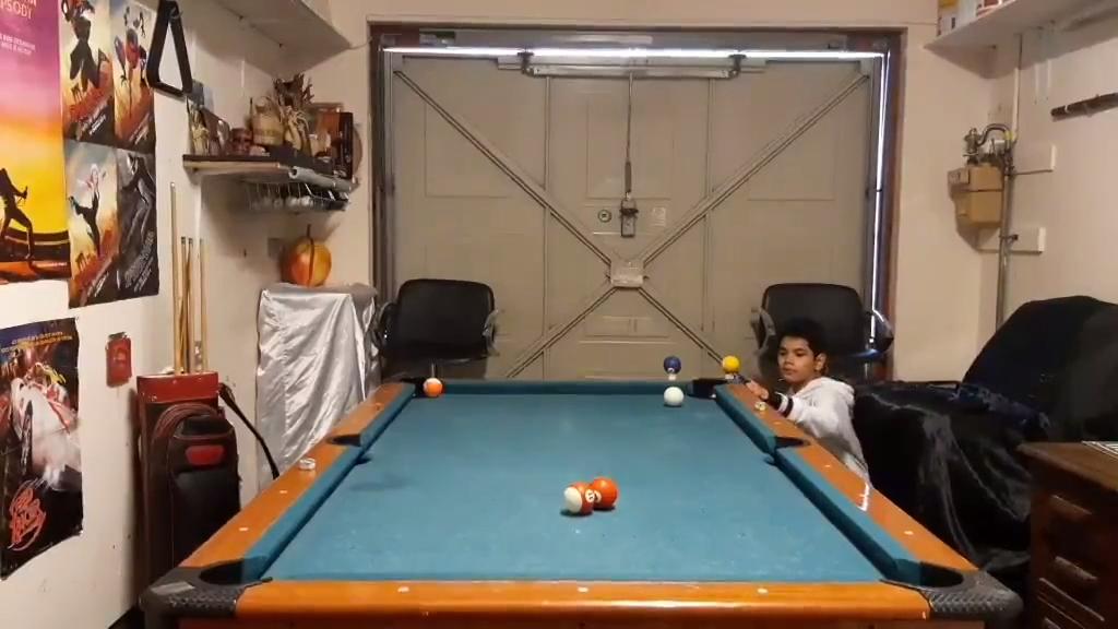 Boy Demonstrates Pool Trick by Skilfully Shooting Balls Into Table ...