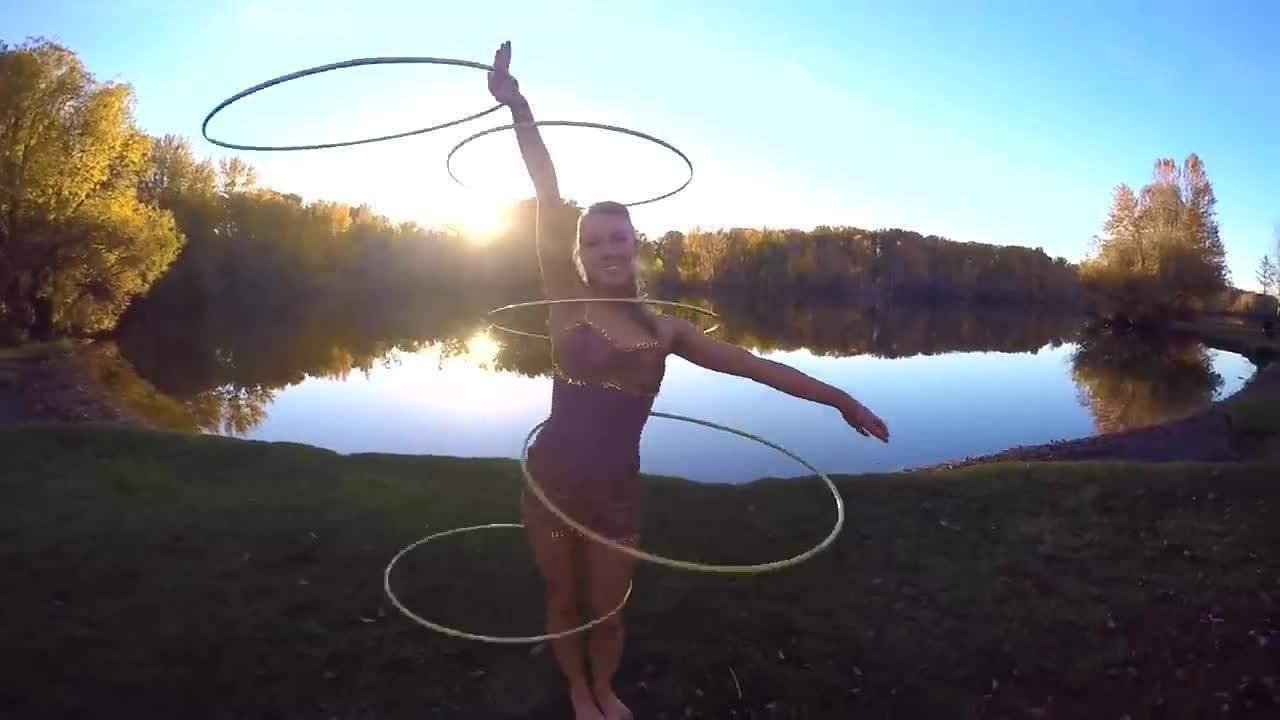Girl Shows Amazing Moves and Tricks While Spinning Multiple Hula Hoops ...