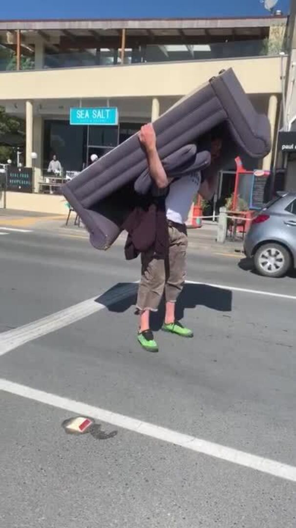 Man Carrying Couch Occupies Entire Lane | Jukin Licensing