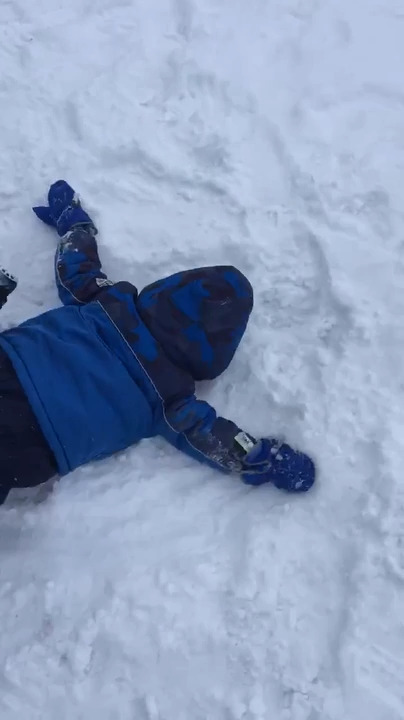Kid Going Down Slide on his Belly Faceplants to the Snowy Ground ...