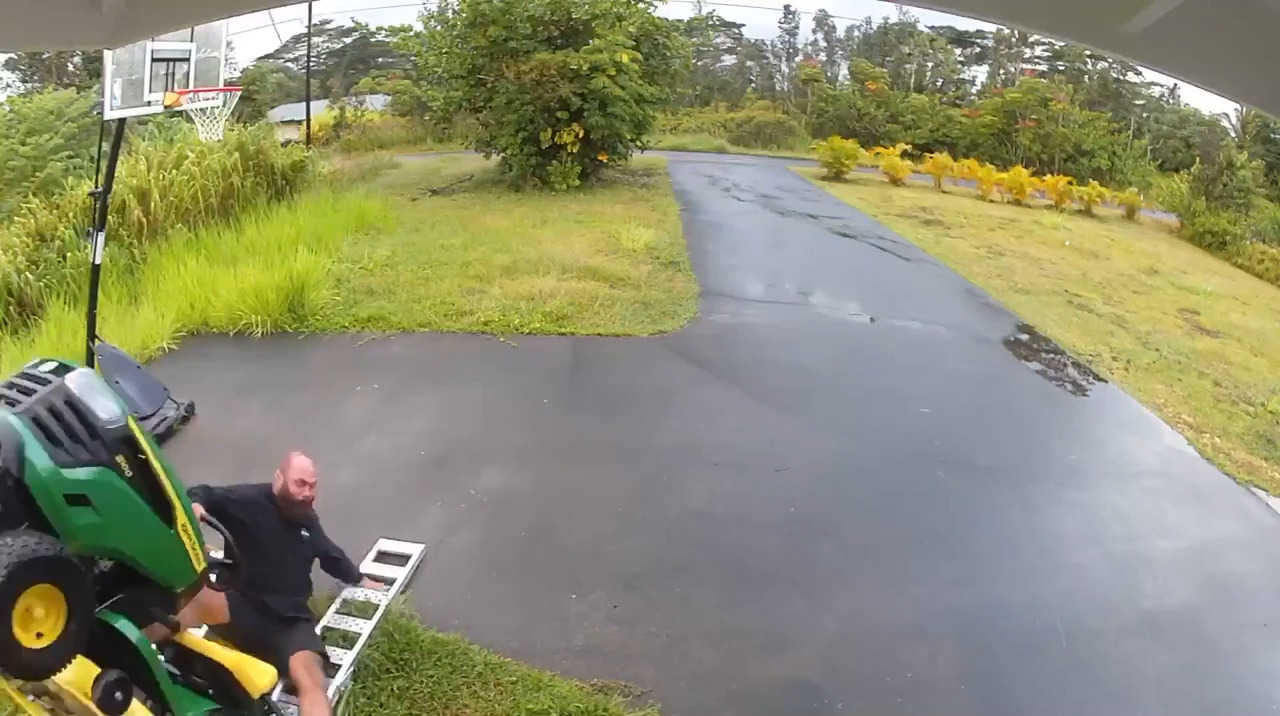 Guy Falls While Moving Mower Over Ramp | Jukin Licensing
