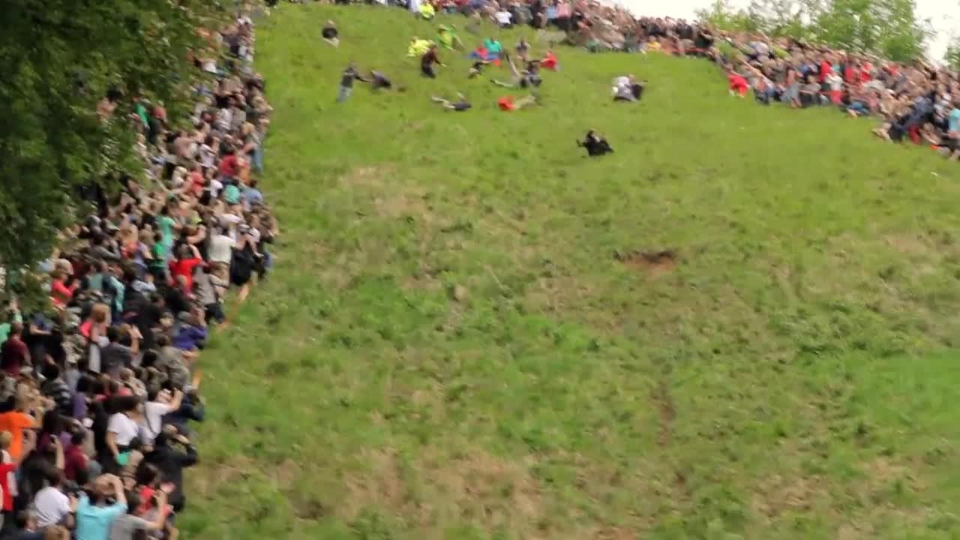 People Tumble down Hill in Cheese Roll | Jukin Licensing