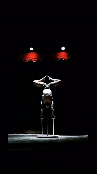 Acrobat Performs Smooth Leg Movements While Balancing in Handstand ...
