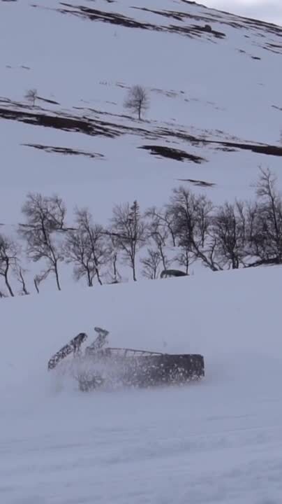 Person Crash Lands Into Snow After Jumping With Their Snowmobile ...