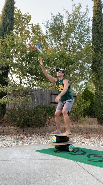 Trick Shot Artist Catches Sticks By Their Colors While Balancing on ...