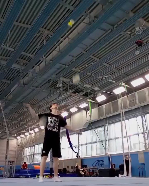 Circus Artist Shows Amazing Skills While Juggling Diabolos Behind His ...