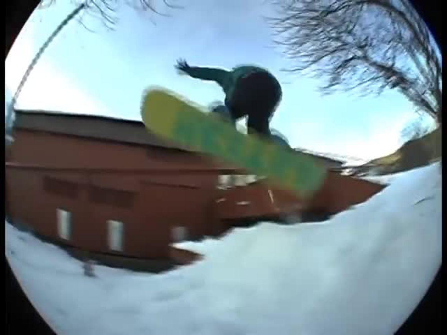 Snowboarder Falls over Railing during Grind | Jukin Licensing