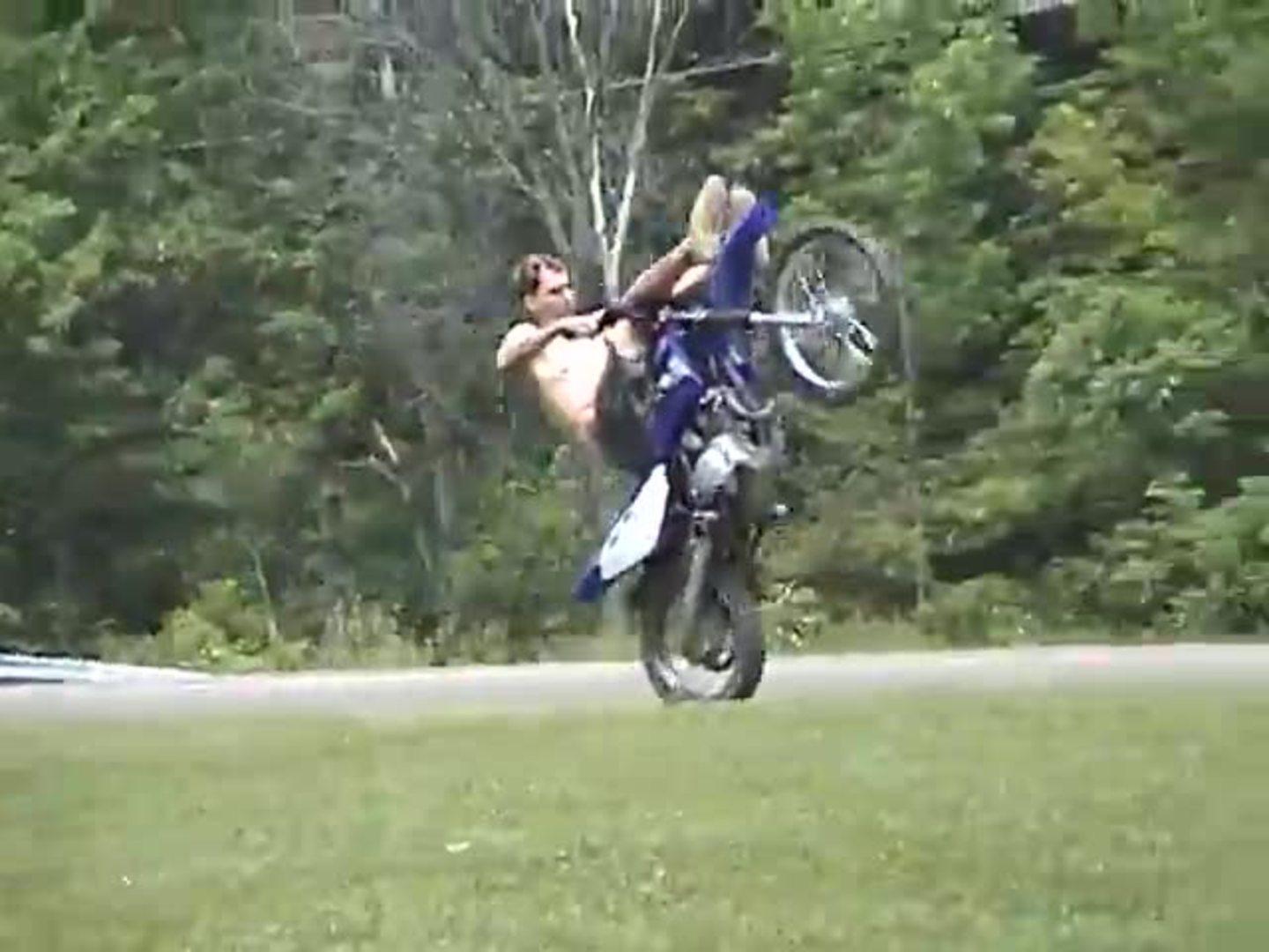 Man On Dirtbike Tries Wheelie With Feet Over Handlebars and Falls ...