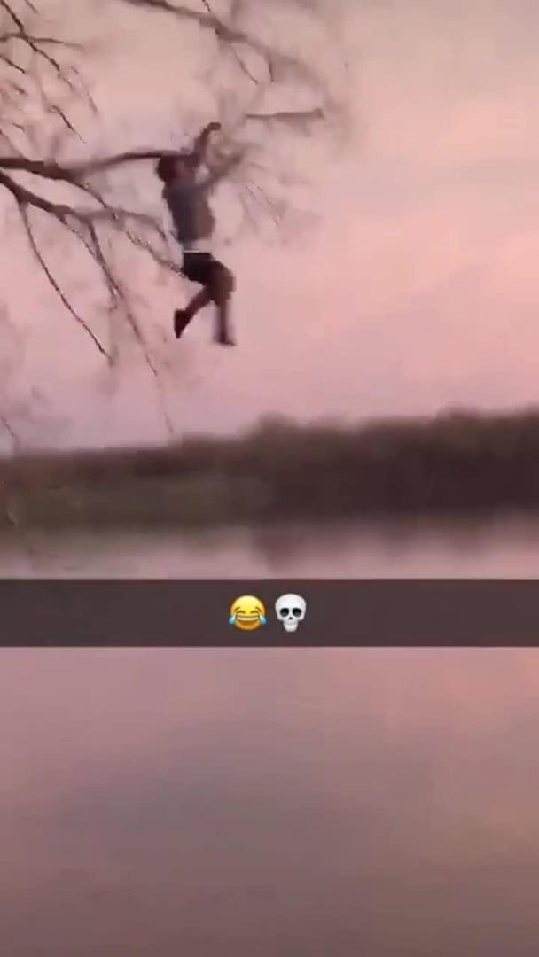 Guy Falls off Tree Into the Water Below | Jukin Licensing