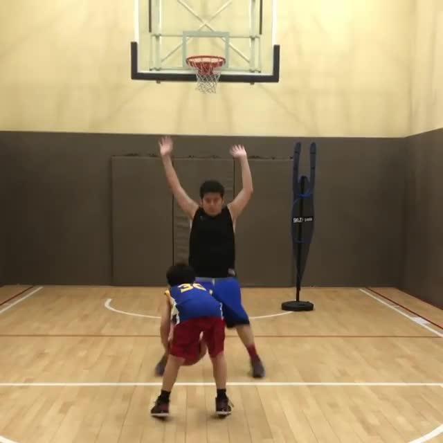 Little Boy Practices Dodging in Basketball with Dad | Jukin Licensing