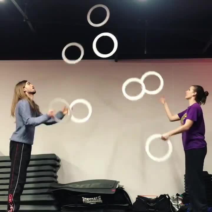 Duo Shows Off Color Changing Effect While Juggling Multiple Hoops ...