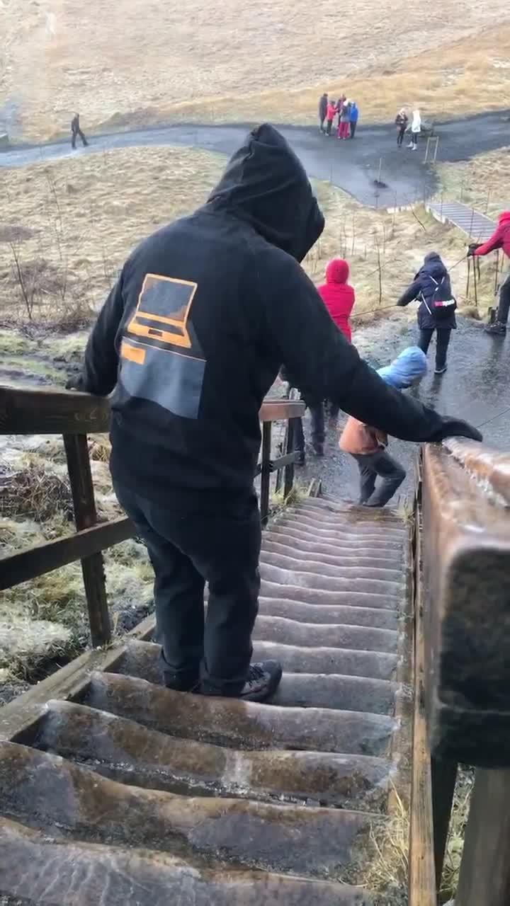 Guy Slips Down Frozen Staircase and Falls on his Butt | Jukin Licensing