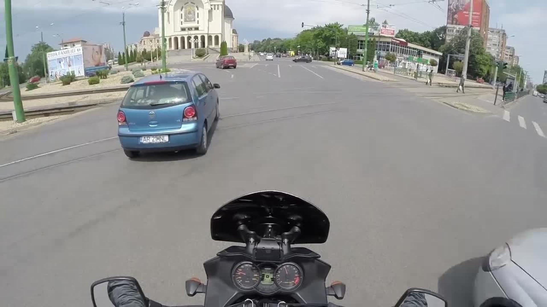 Motorcycle Hits Car Stopped in Intersection | Jukin Licensing