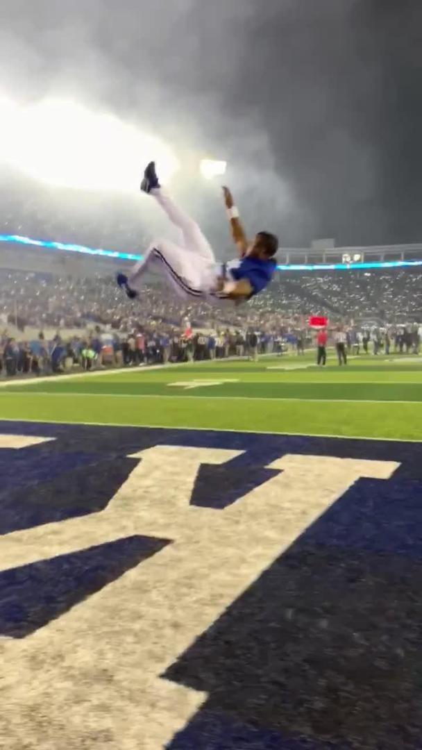 Football Player Performs Series of Flips on Field to Move From One End ...