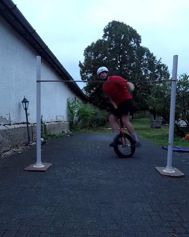 Guy Makes High Jump Over Bar While Riding Unicycle | Jukin Licensing