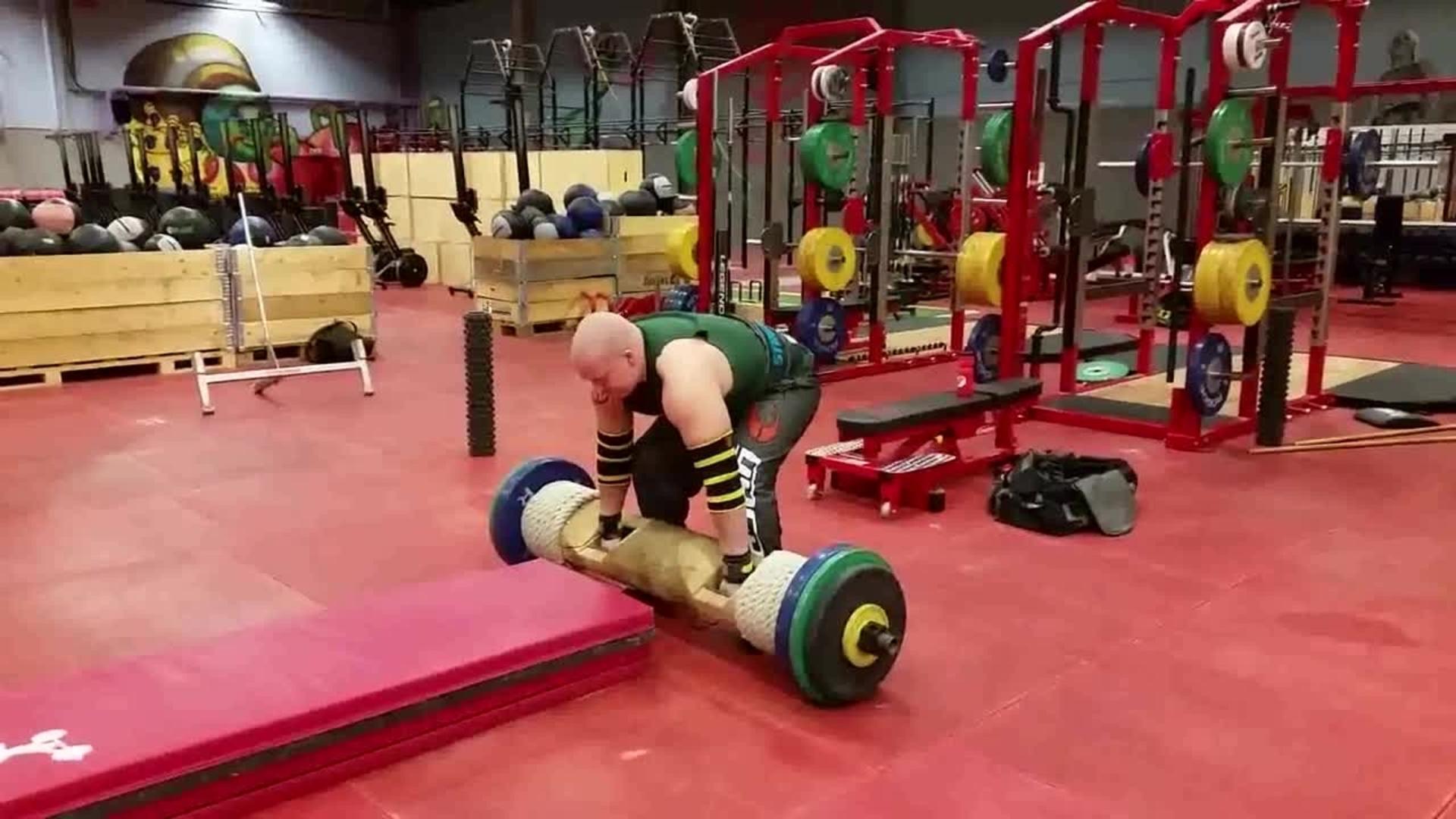 Strongman Shoulder Presses Massive Log and Drops It | Jukin Licensing