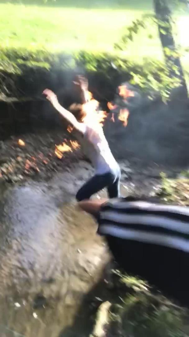 Guy Playing With Fire Accidentally Sets His Back and Hair on Flames ...