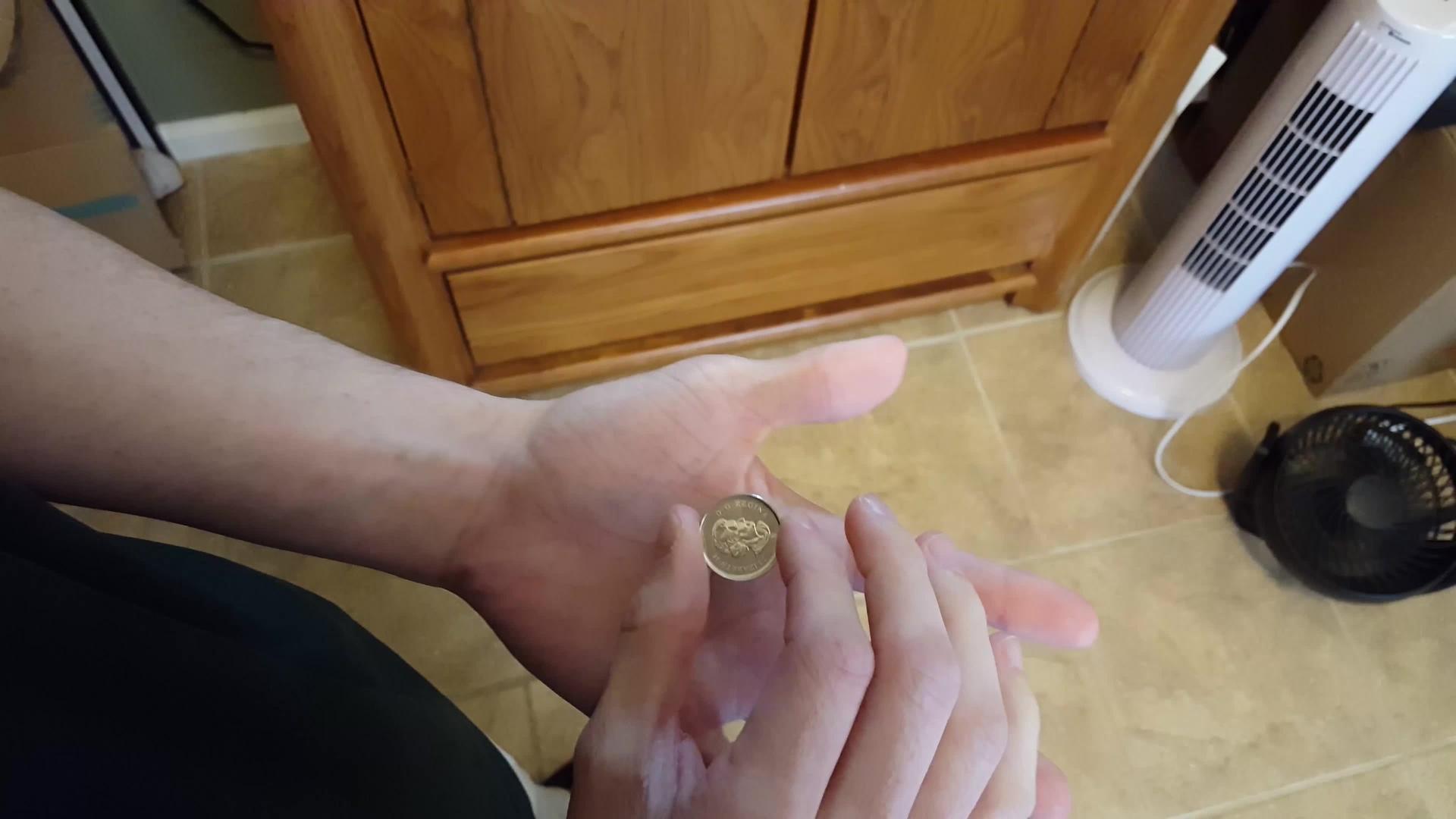 How a Magician Makes a Coin Disappear | Jukin Licensing