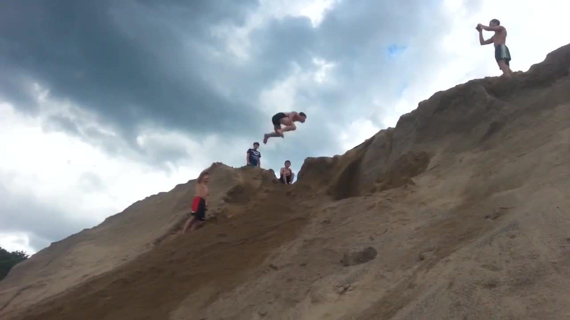 Kid Flips and Slides Down Sand Dune | Jukin Licensing
