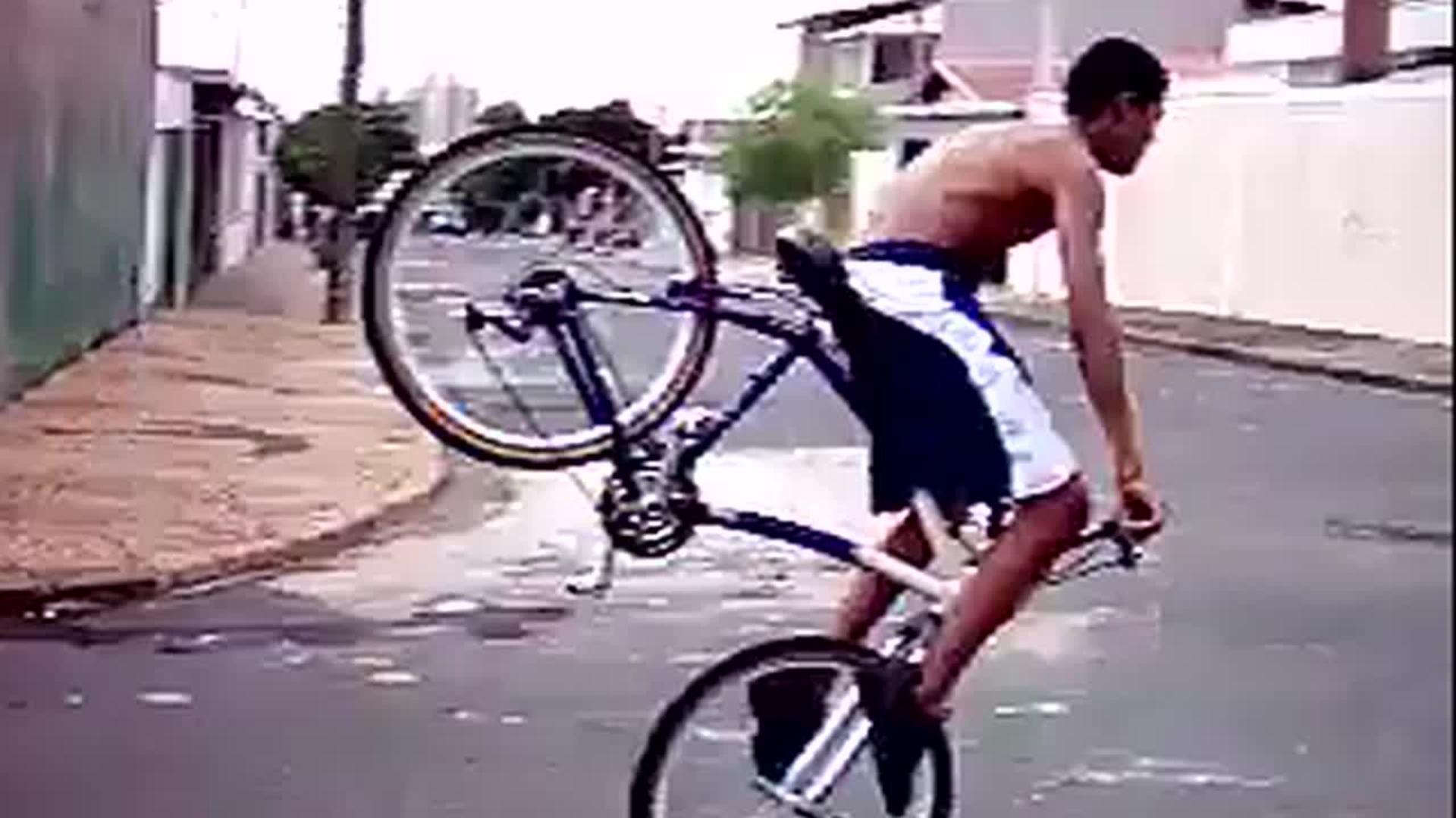 Shirtless Cyclist Flies over Handlebar Attempting Stoppie | Jukin Licensing