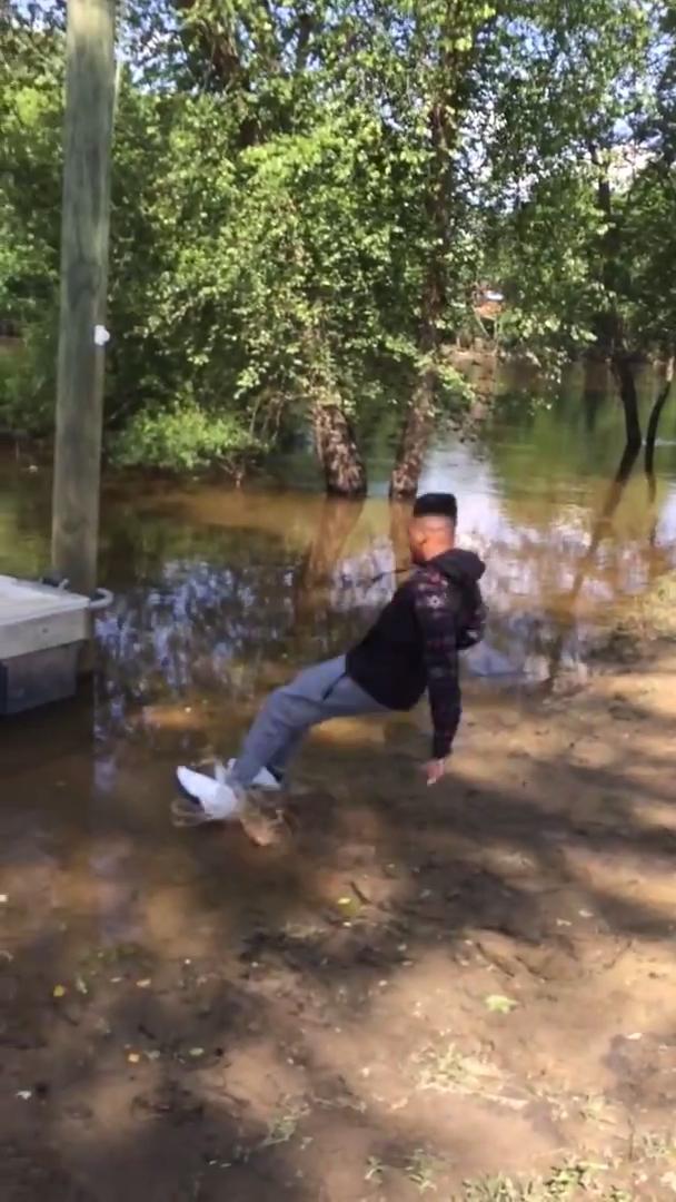 Guy Attempts to Jump Over Puddle and Falls | Jukin Licensing
