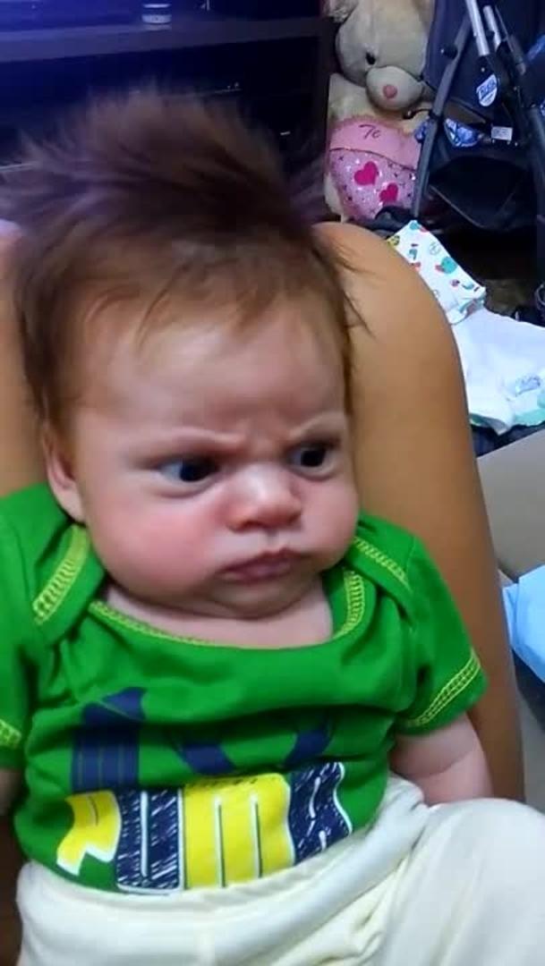 Baby Scowls at Parents Trying to Make Him Smile | Jukin Licensing