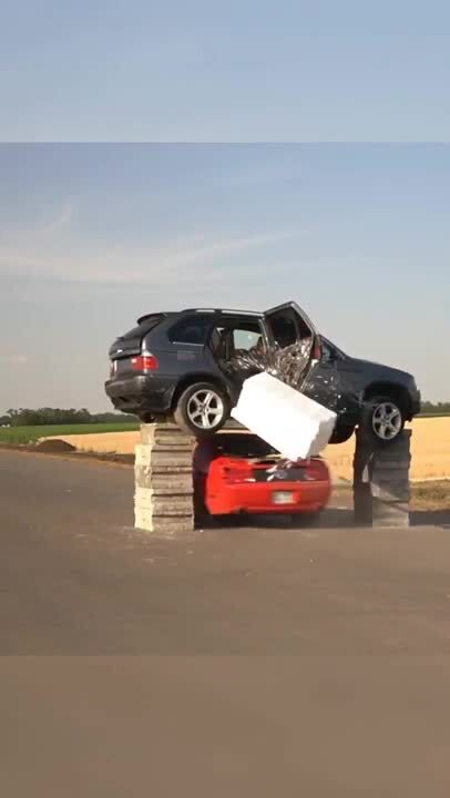 Stuntman Jumps Through Open Car Propped up on Stone Ledges | Jukin ...