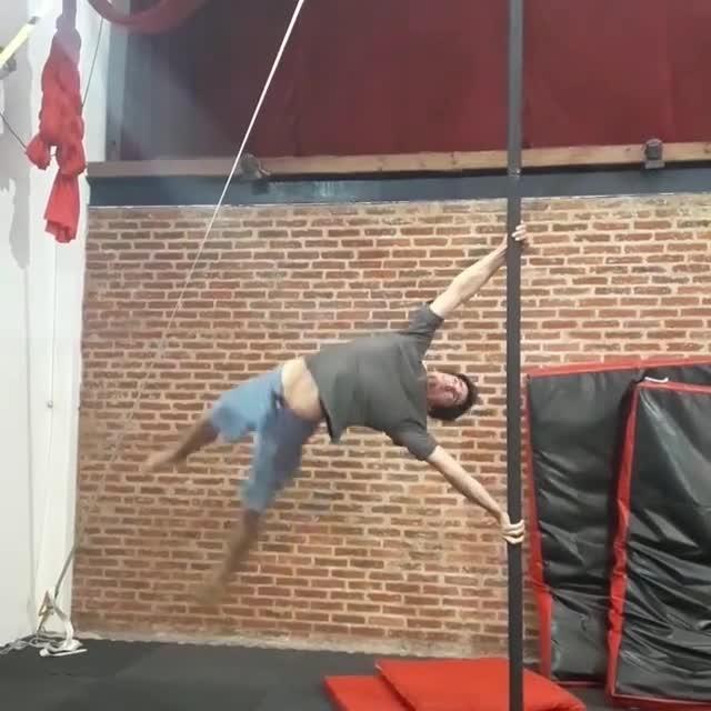 Guy Performs Impressive Flag Pose on Chinese Pole | Jukin Licensing