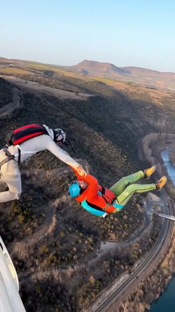 Duo Catapults Each Other Off Bridge For Base Jumping | Jukin Licensing