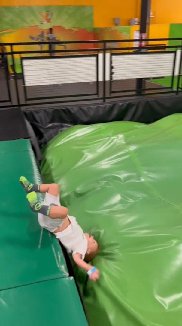 Little Boy Attempts Backflip at Trampoline Park and Tumbles Backwards ...