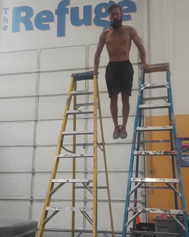 Guy Does Handstand on Ladders | Jukin Licensing