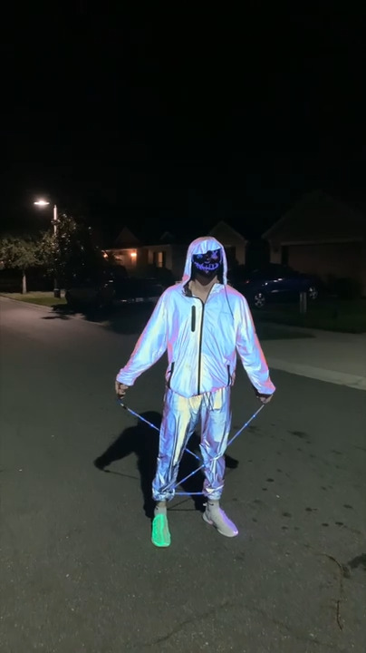 Guy Wearing Reflective Tracksuit Shows Skipping Routine With Led Rope ...
