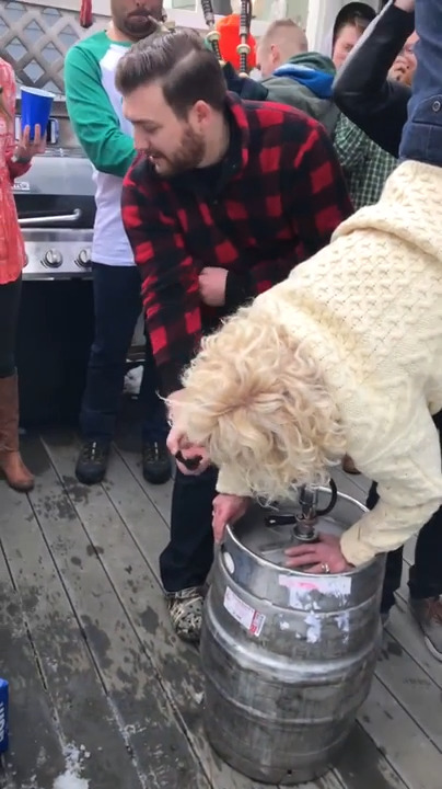 Elderly Woman Chugs Beer While Doing Kegstand With Help of People ...