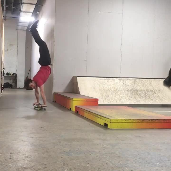 Guy Riding Skateboard in Handstand Position Effortlessly Transitions ...