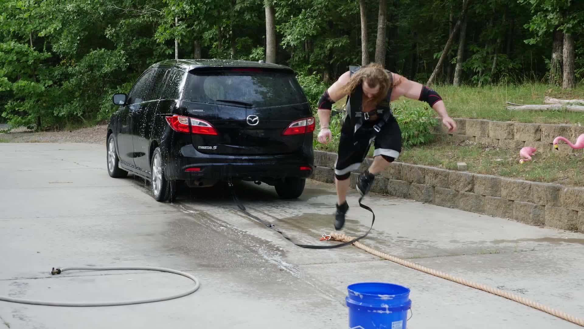 Strong Man Pulls Car and Gives It a Wash | Jukin Licensing