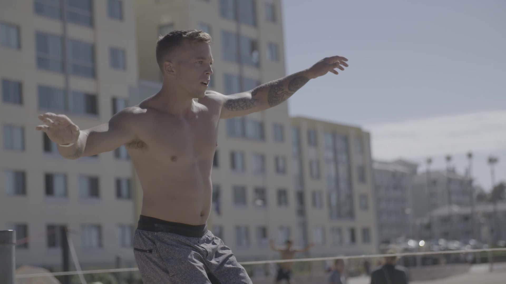 Athletes Practice Slackline Tricks on the Beach in Slow Motion | Jukin ...